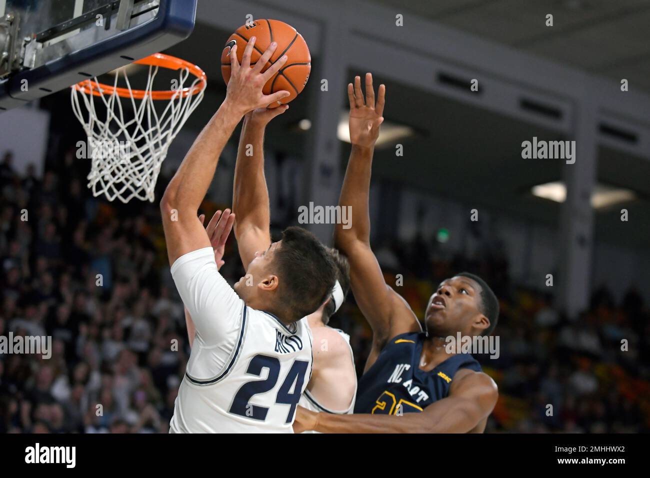 Utah State guard Diogo Brito (24) takes a shot as North Carolina A&T ...