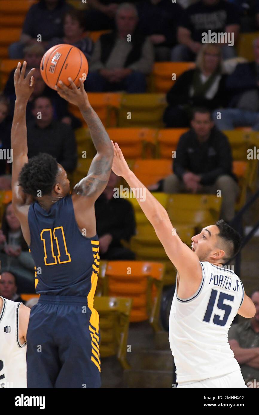 North Carolina A&T guard Tyler Maye (11) takes a shot as Utah State ...