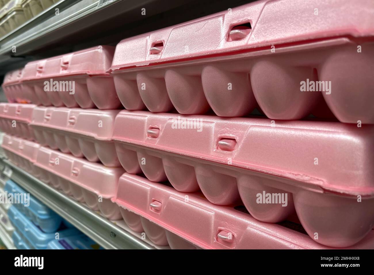 Rows of pink styrofoam egg cartons on a grocery store shelf Stock Photo ...