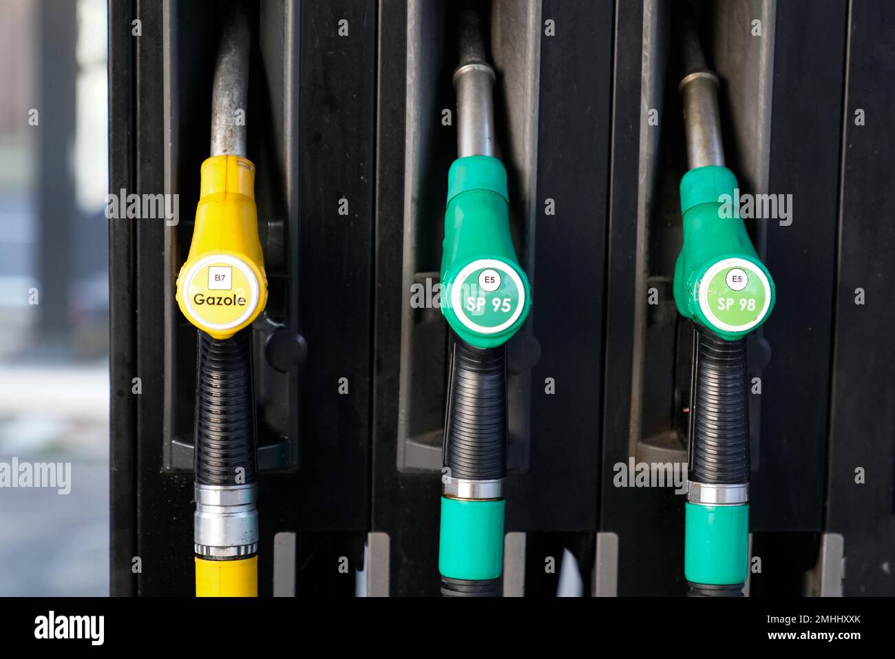 Fuel crane gaz equipment filling guns at the gas station Stock Photo ...