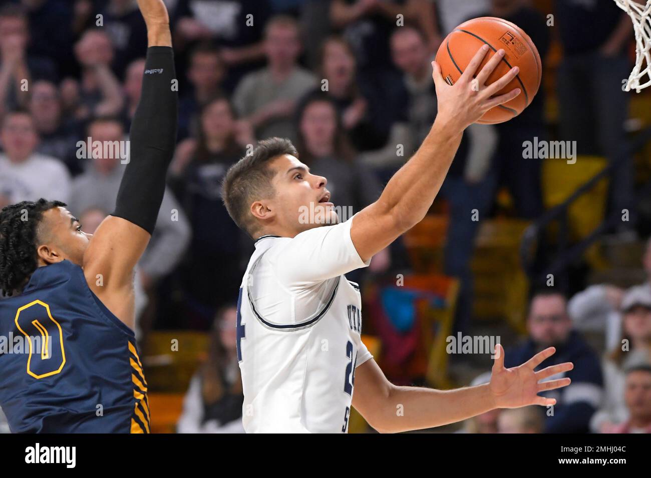Utah State guard Diogo Brito (24) shoots as North Carolina A&T guard ...