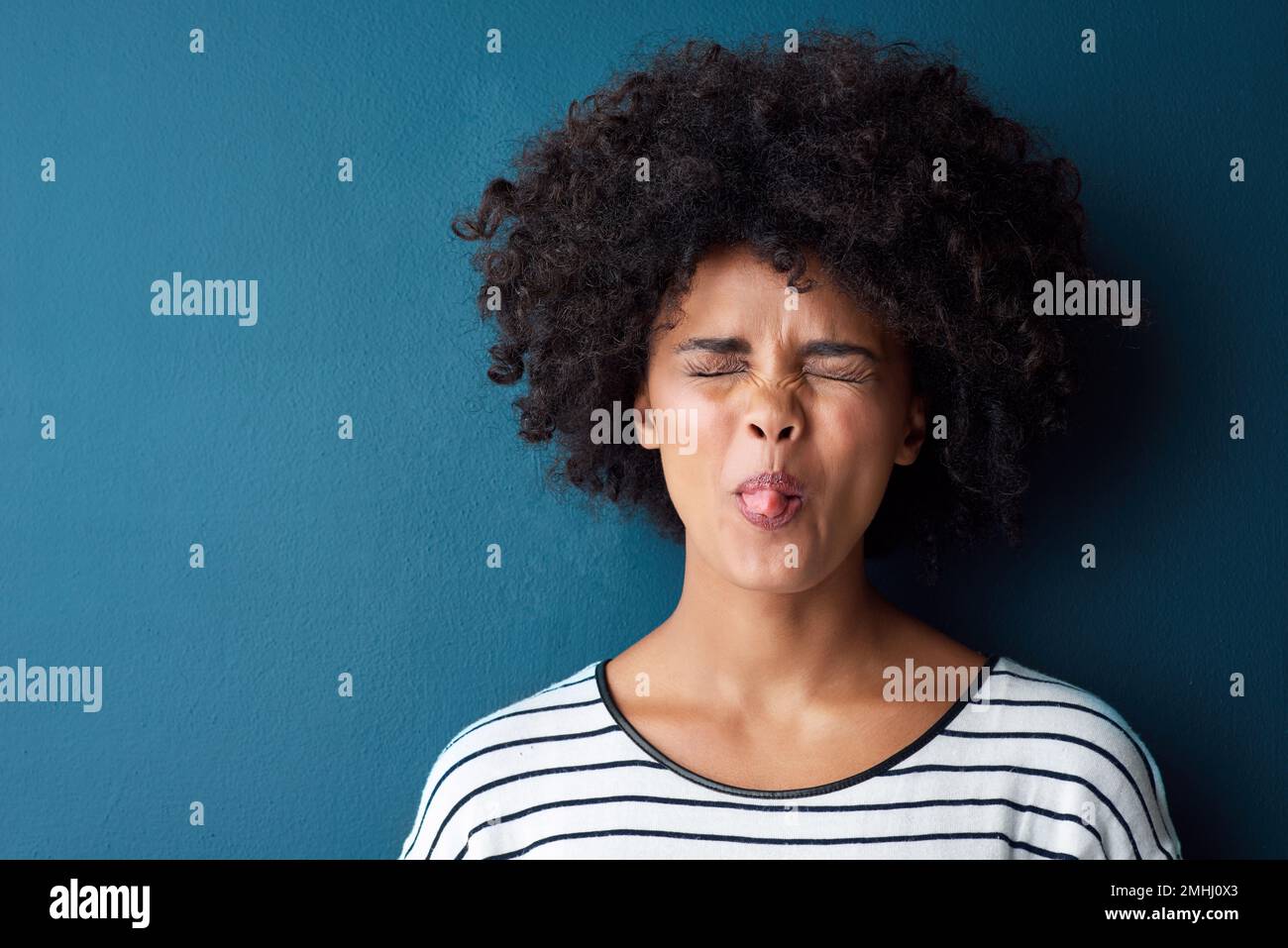 Just goofing around. Studio portrait of an attractive young woman ...