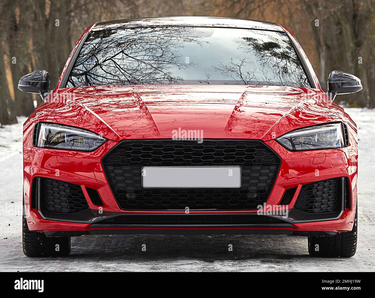 Modern red car driving on the road, city car background Stock Photo - Alamy