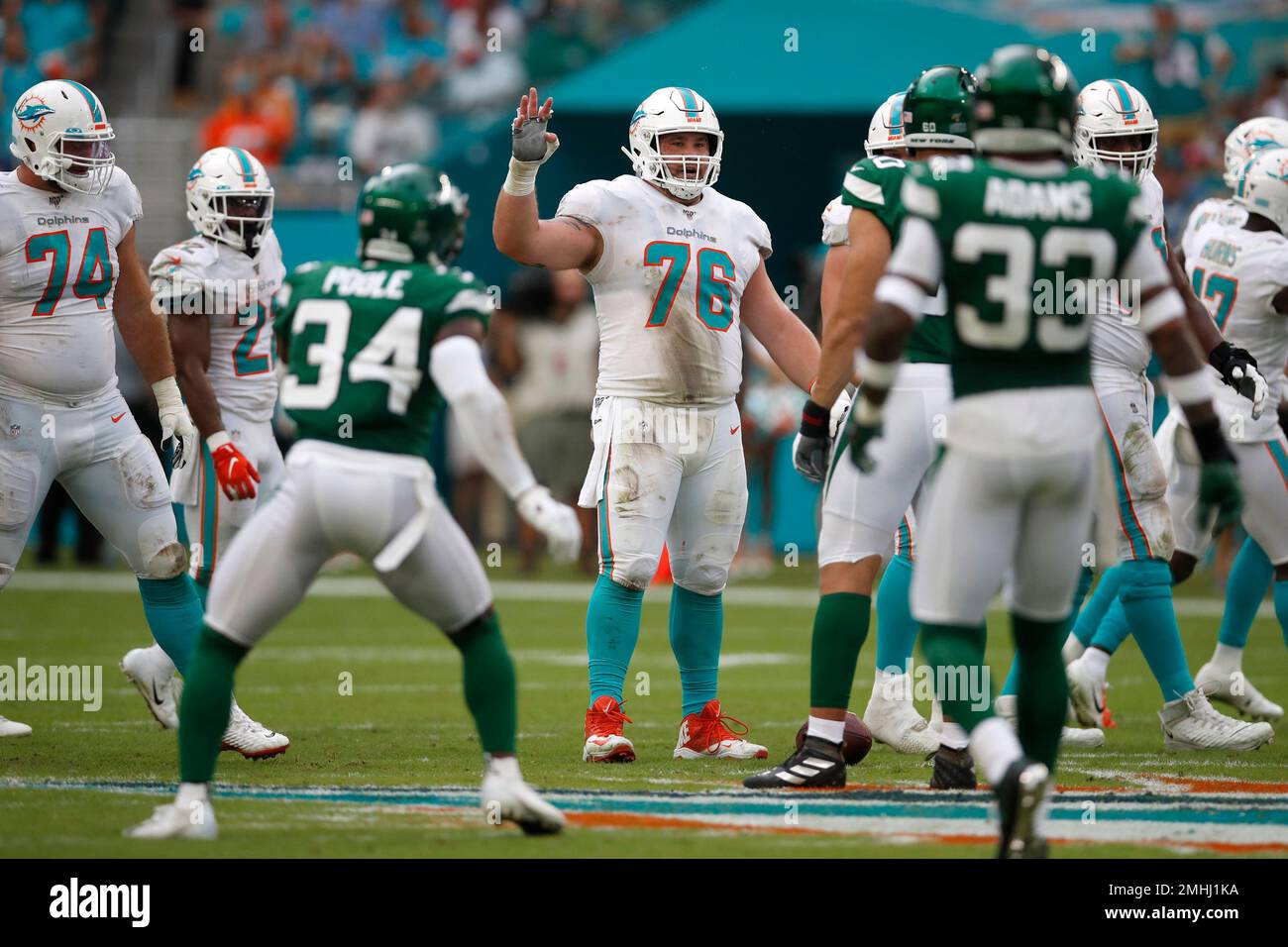 Miami Dolphins center Evan Boehm (76) looks over the defense of the New ...