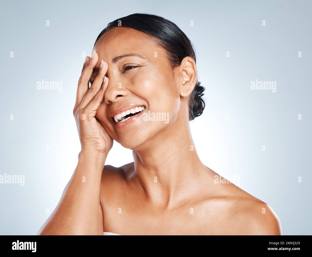 Laughing, hand and woman in studio for skincare, hygiene and grooming ...