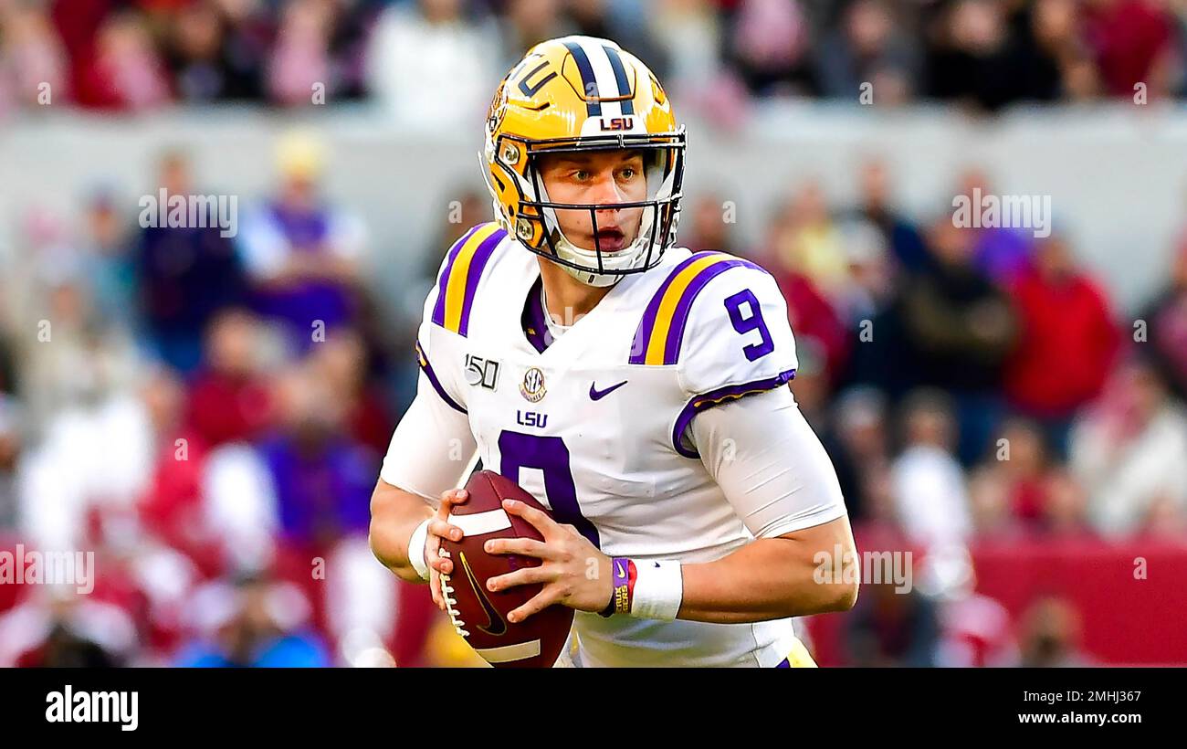 LSU quarterback Joe Burrow looks for an open receiver in the first half ...
