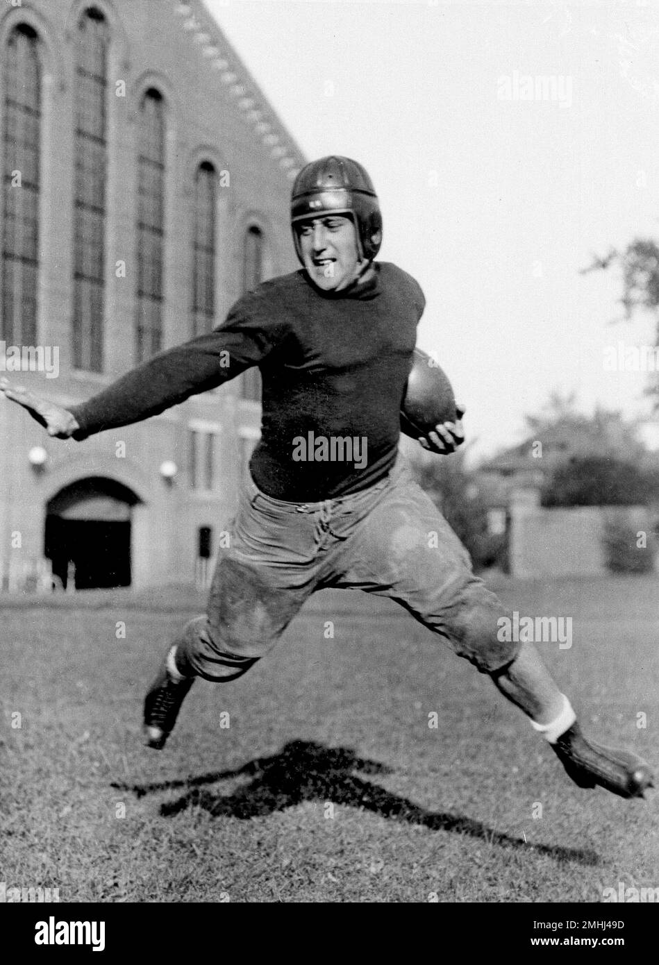 Harry Newman, quarterback of the Michigan Wolverines is shown in action ...