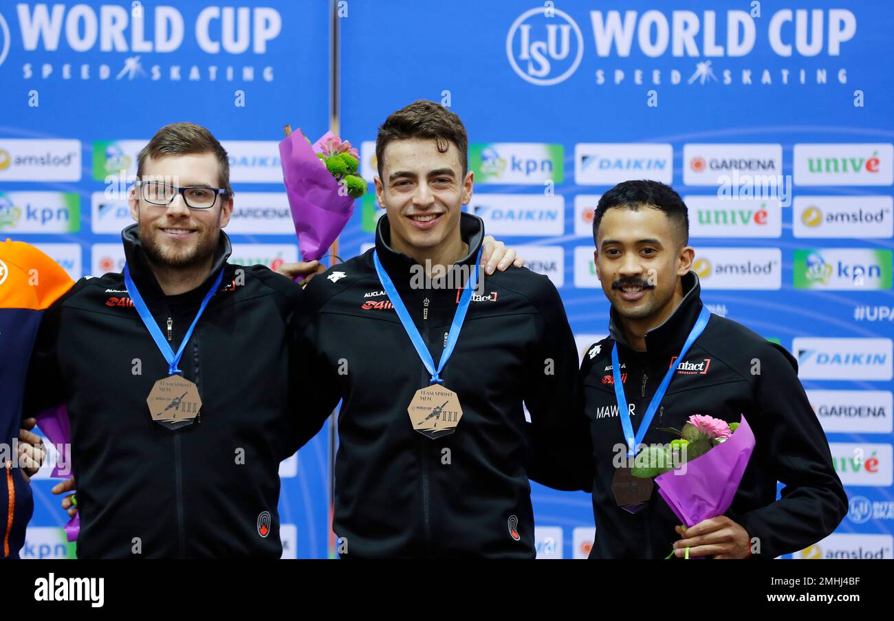 Canada's skaters team celebrates on the podium after taking third place ...