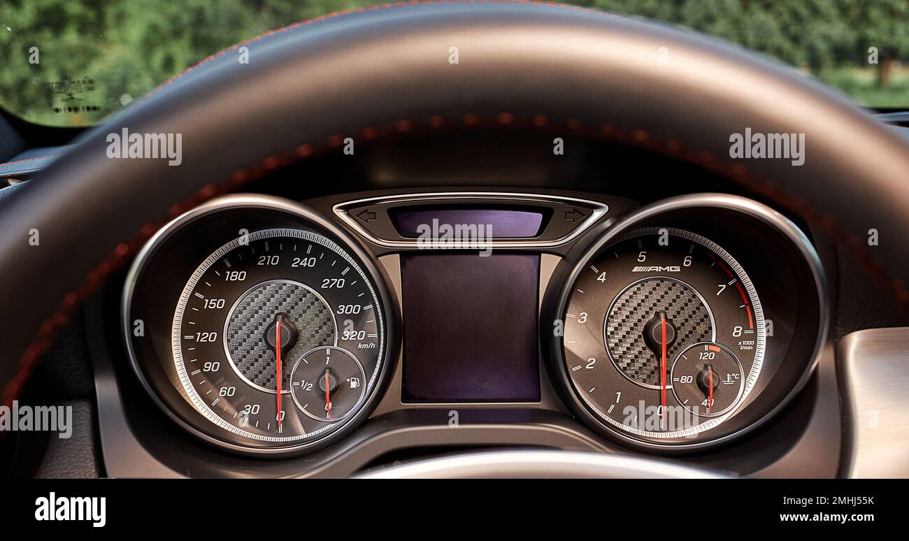 Sport car speedometer and sensors on a control panel background, modern ...