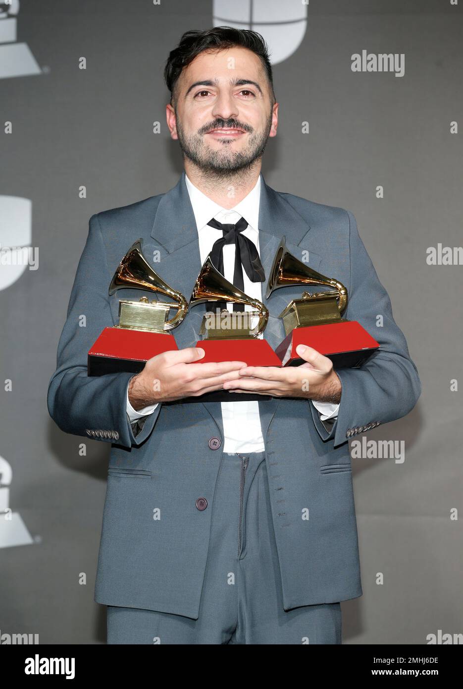 El Guincho poses in the press room with the awards for album of the ...