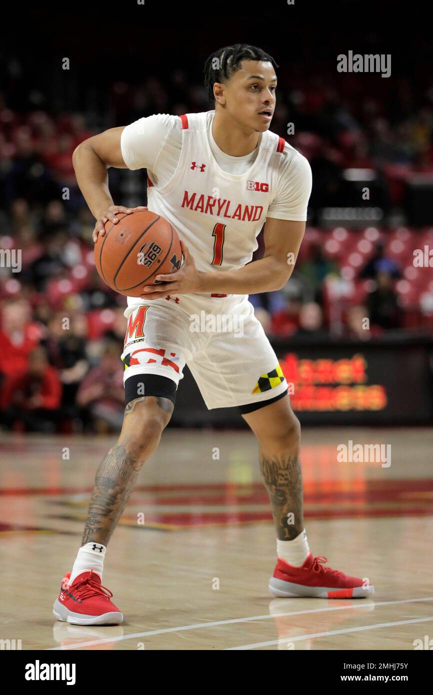 Maryland guard Anthony Cowan Jr. looks to pass the ball against Rhode ...
