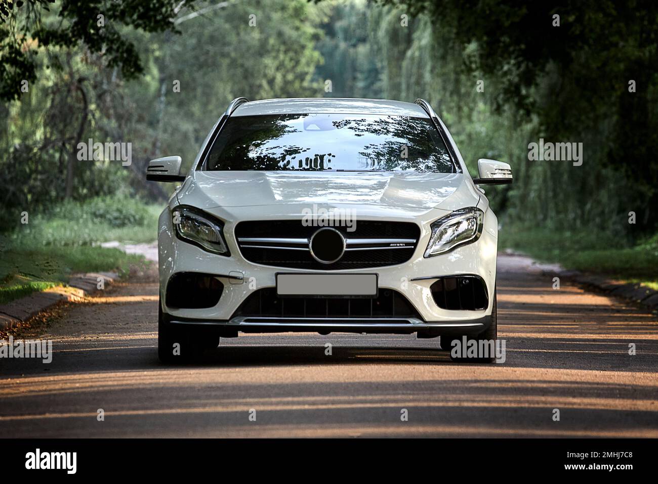 Modern white car driving in the country side background, luxury city ...