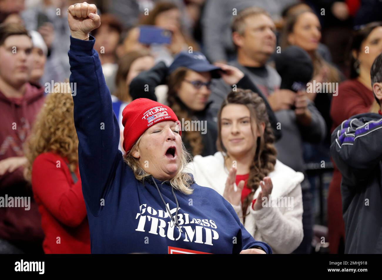 A woman cheers at the start of a campaign rally for President Donald ...