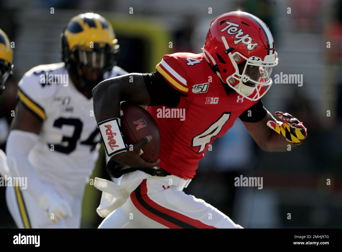 Maryland quarterback Lance LeGendre runs with the ball against Michigan ...