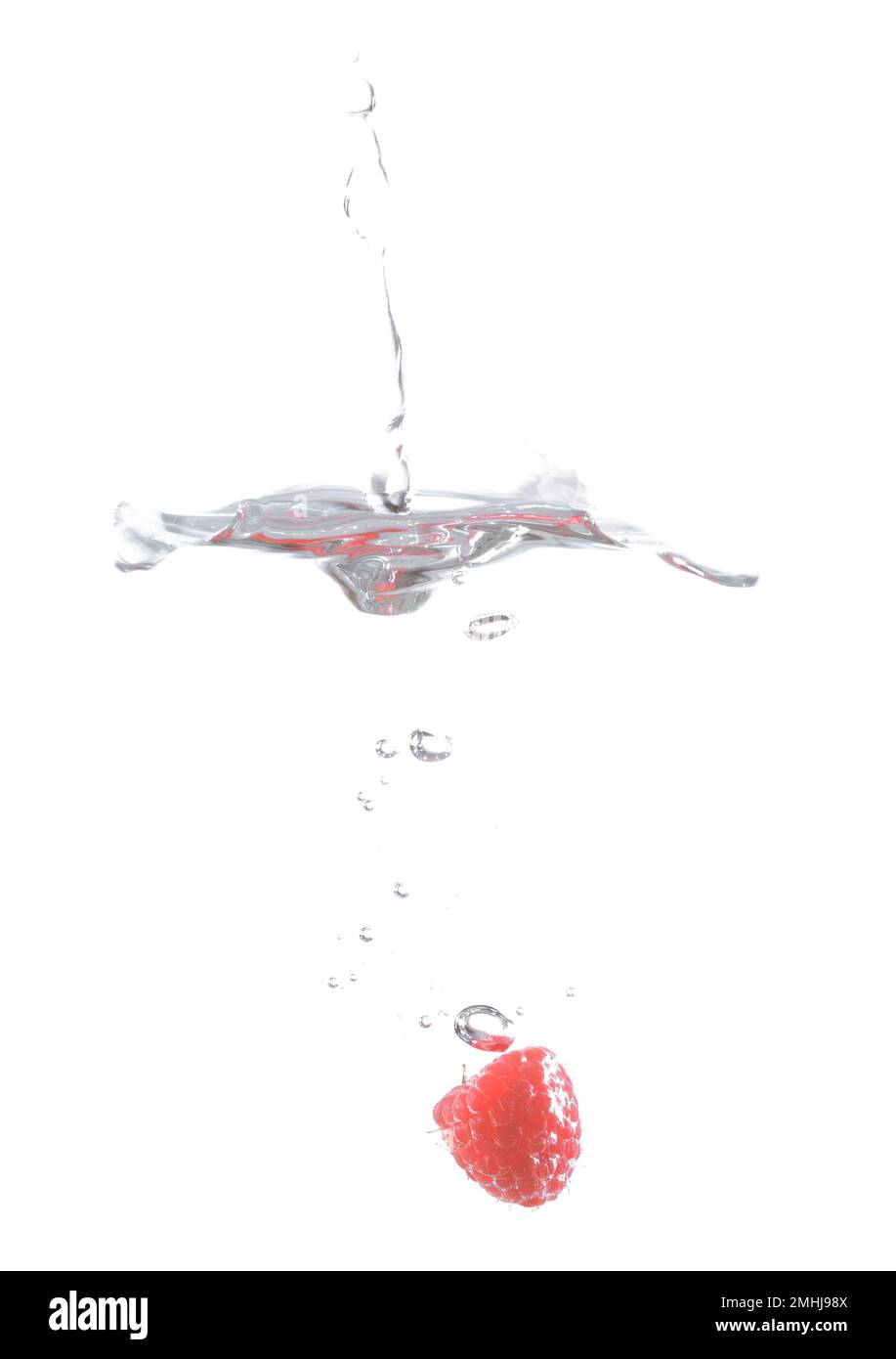 Raspberry falls deeply under water with a big splash Stock Photo - Alamy