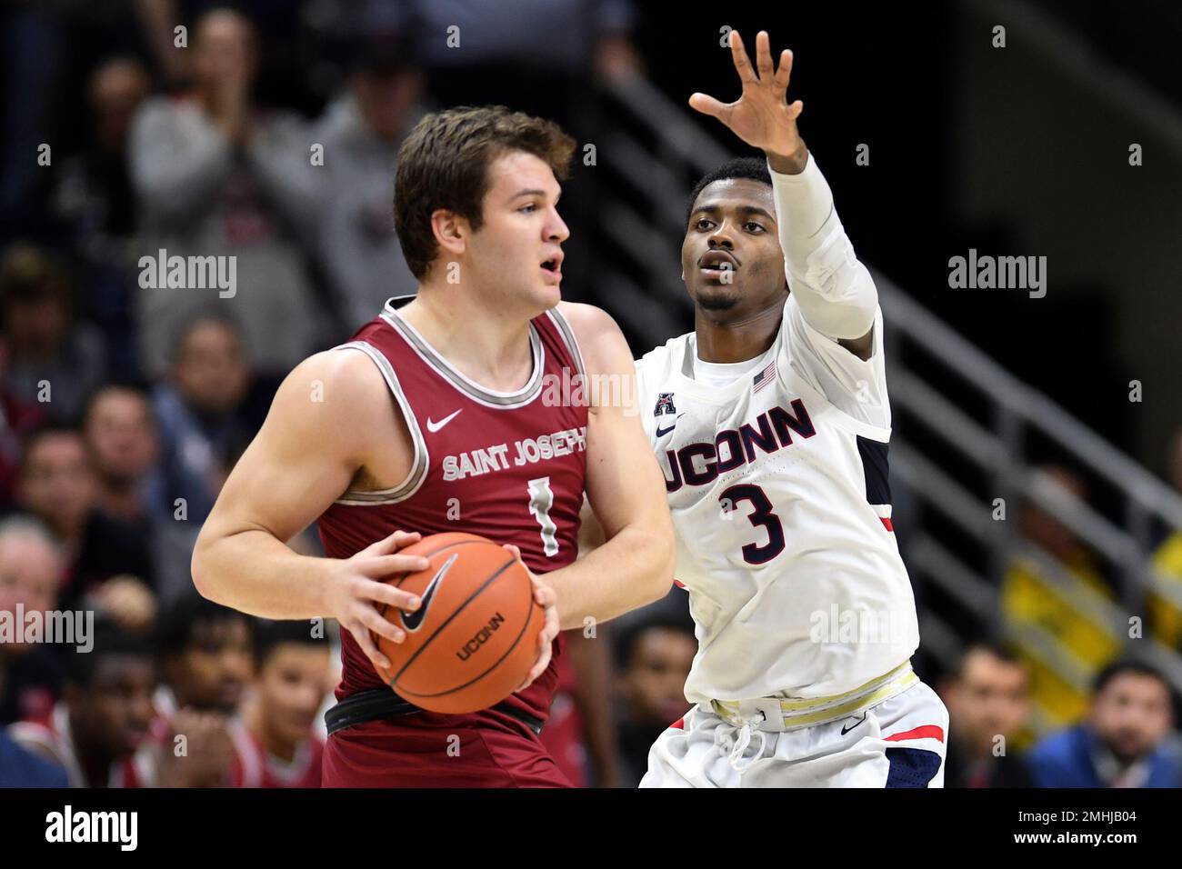 Connecticut's Alterique Gilbert (3) guards Saint Joseph's guard Ryan ...