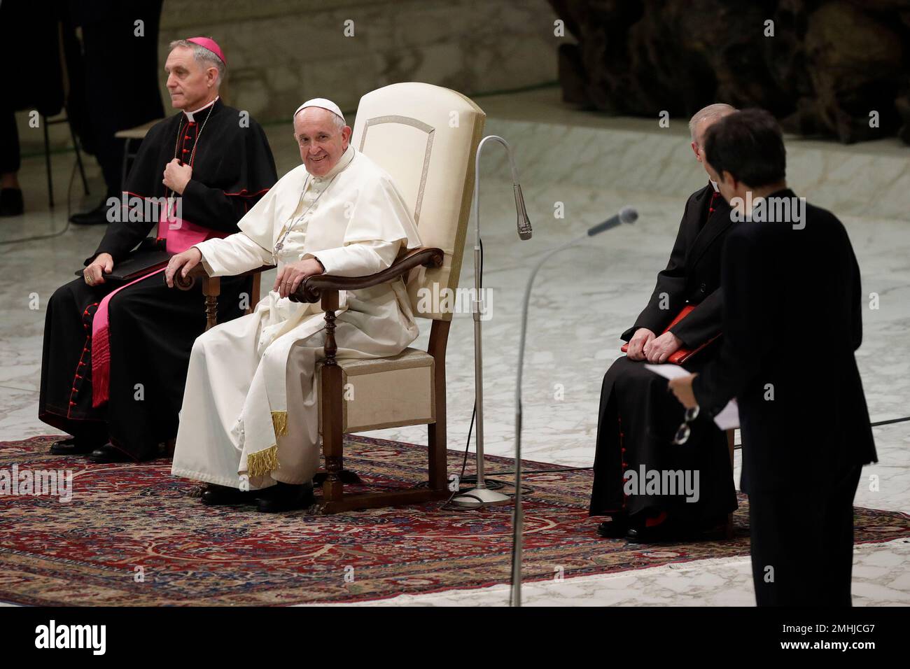 Pope Francis sits in the Paul VI Hall at the Vatican during an audience ...