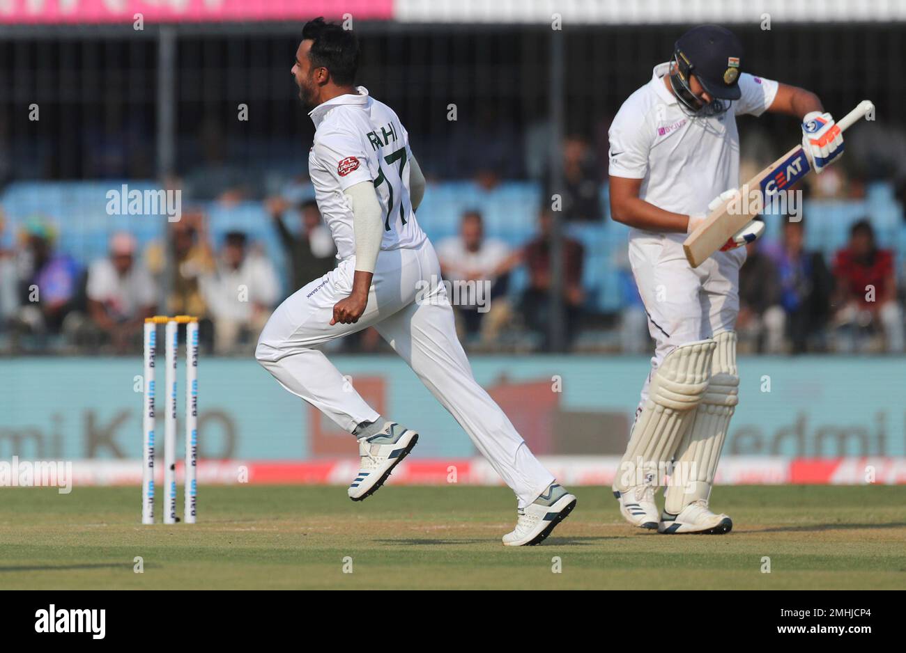Bangladesh's Abu Jayed, left, runs to celebrate the dismissal of India ...