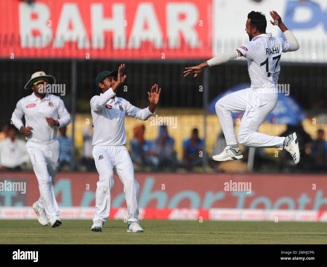 Bangladesh's Abu Jayed, right, leaps in the air to celebrate the ...