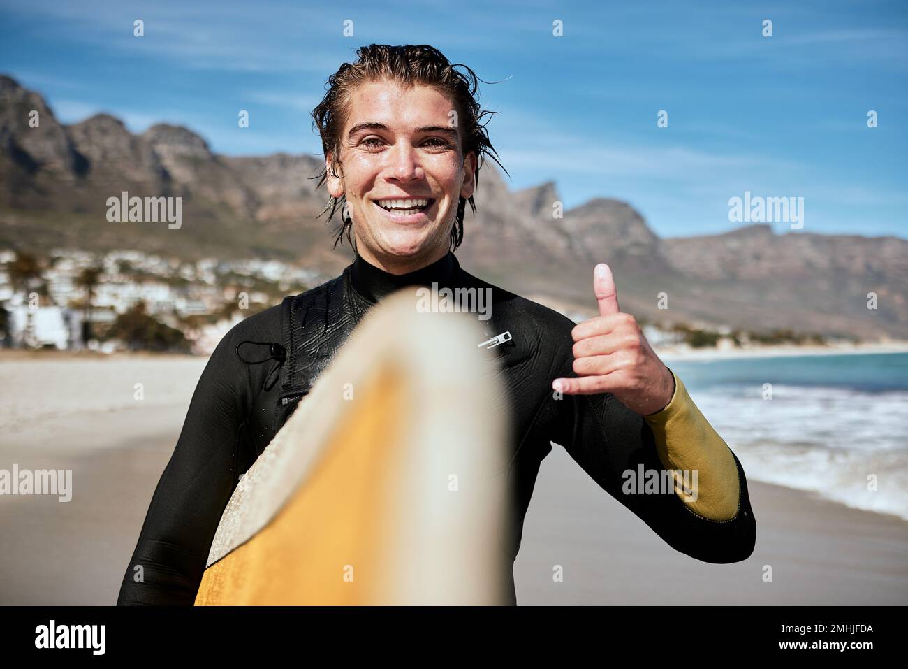 Shaka hand sign, beach and surfer with surfboard for fitness, fun and ...