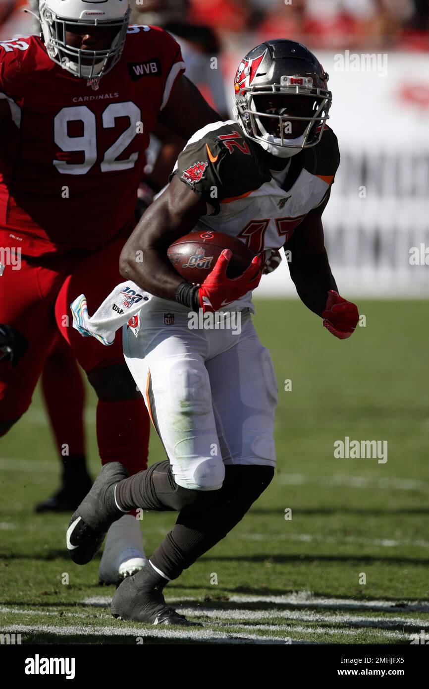 Tampa Bay Buccaneers wide receiver Chris Godwin (12) runs with the ball ...