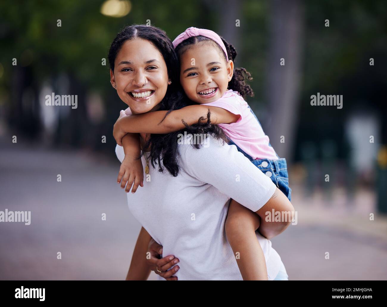 Portrait, mother piggyback child in park, family with fun day outdoor ...