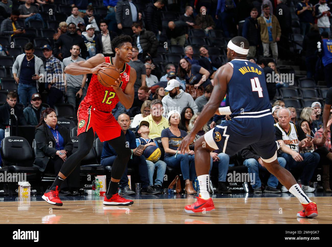 Atlanta Hawks forward De'Andre Hunter (12) and Denver Nuggets forward ...