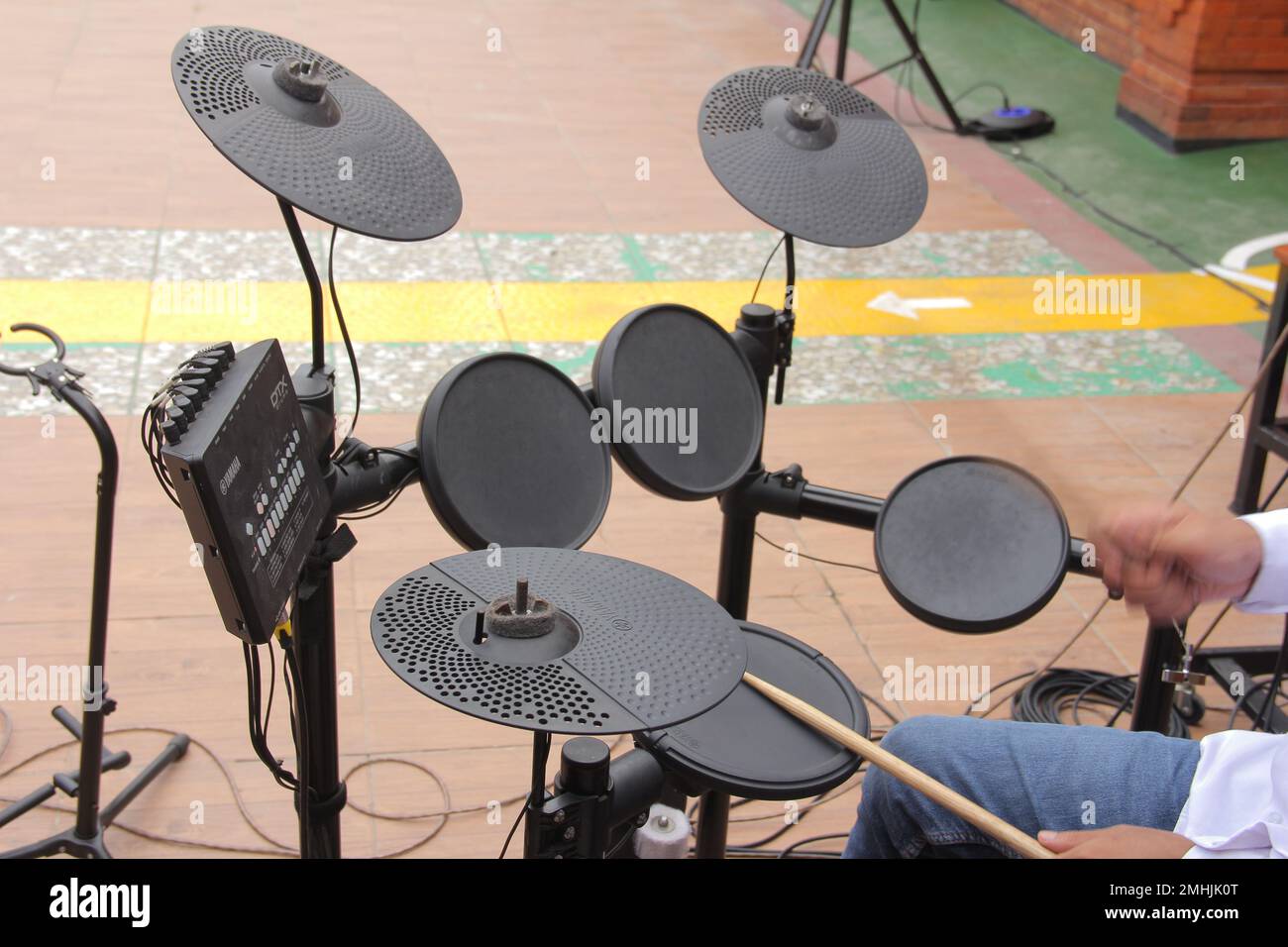 Drummer. The guy holds drum sticks in his hand against the background ...