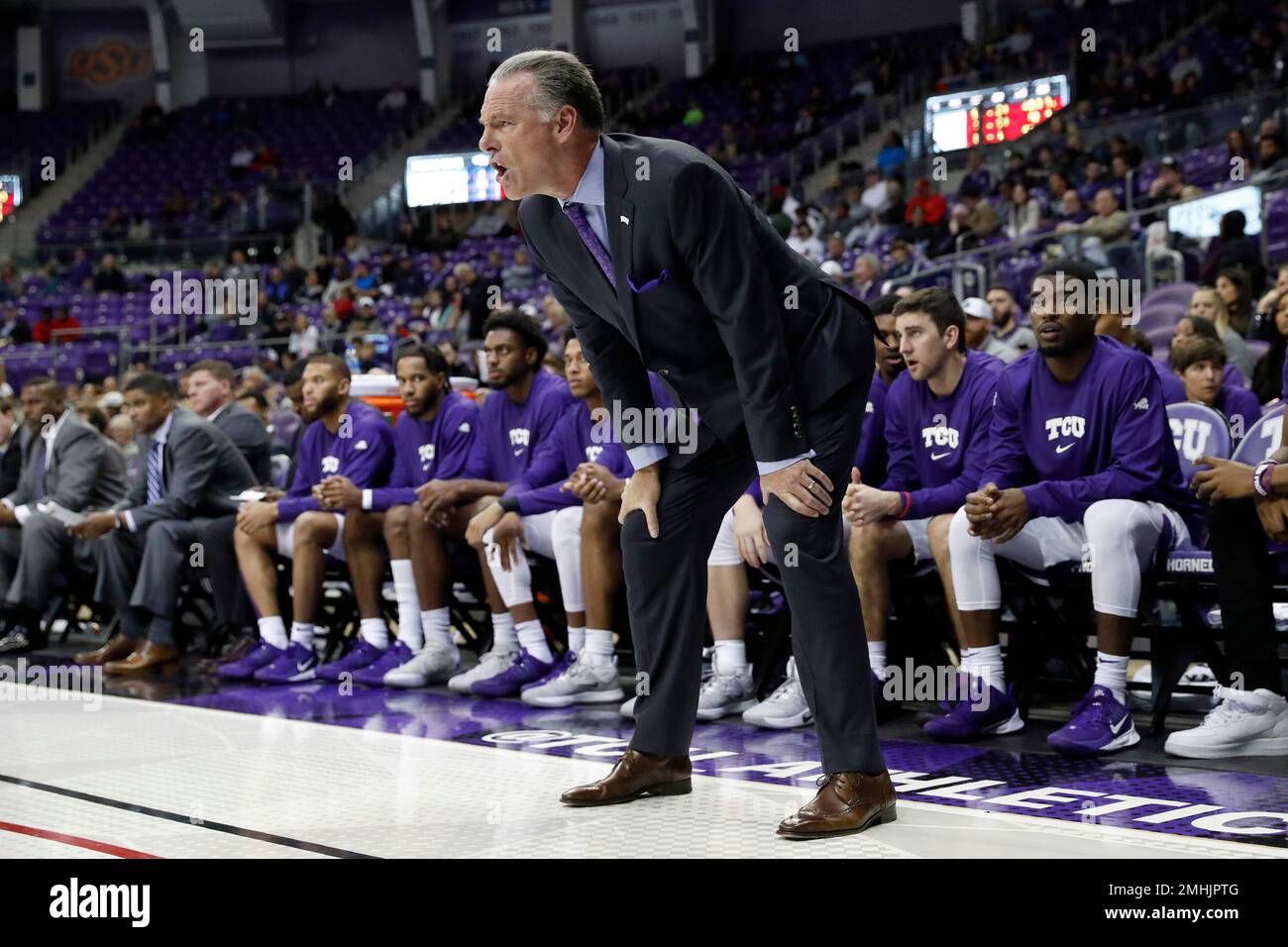 TCU coach Jamie Dixon instructs his team during an NCAA college ...