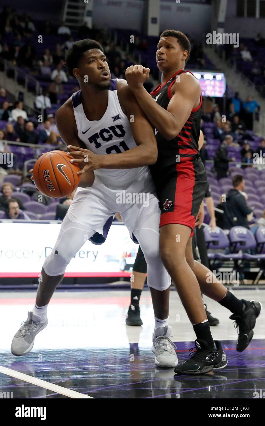 TCU center Kevin Samuel (21) works against Louisiana-Lafayette forward ...