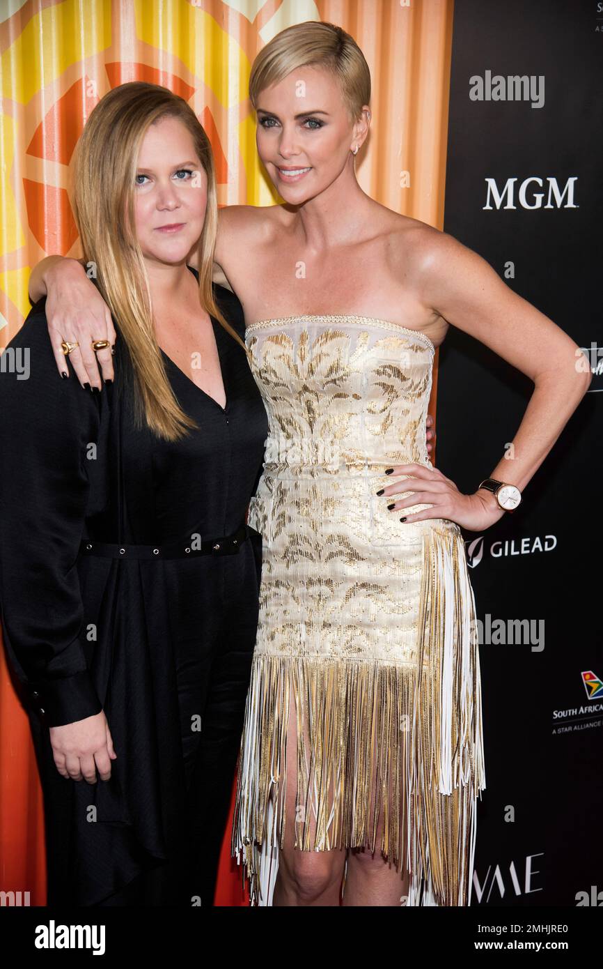 Amy Schumer, left, and Charlize Theron attend The Charlize Theron ...