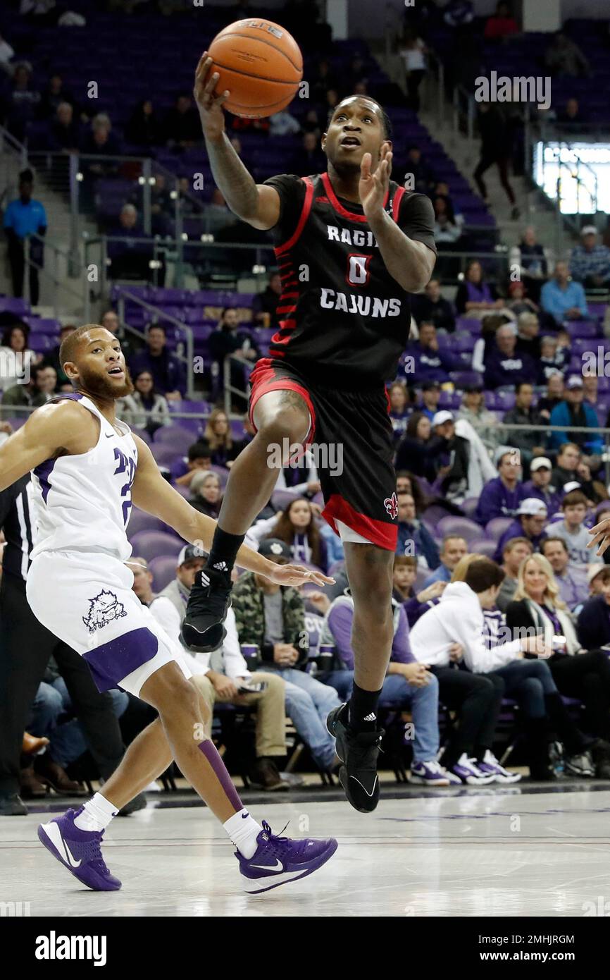 Louisiana-Lafayette guard Cedric Russell (0) gets pat TCU guard Edric ...
