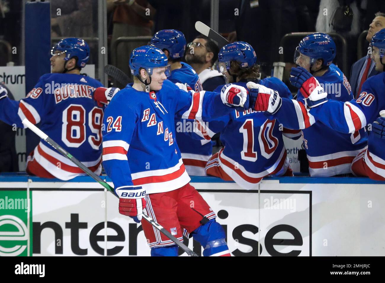 New York Rangers' Kaapo Kakko (24) celebrates with teammates after ...