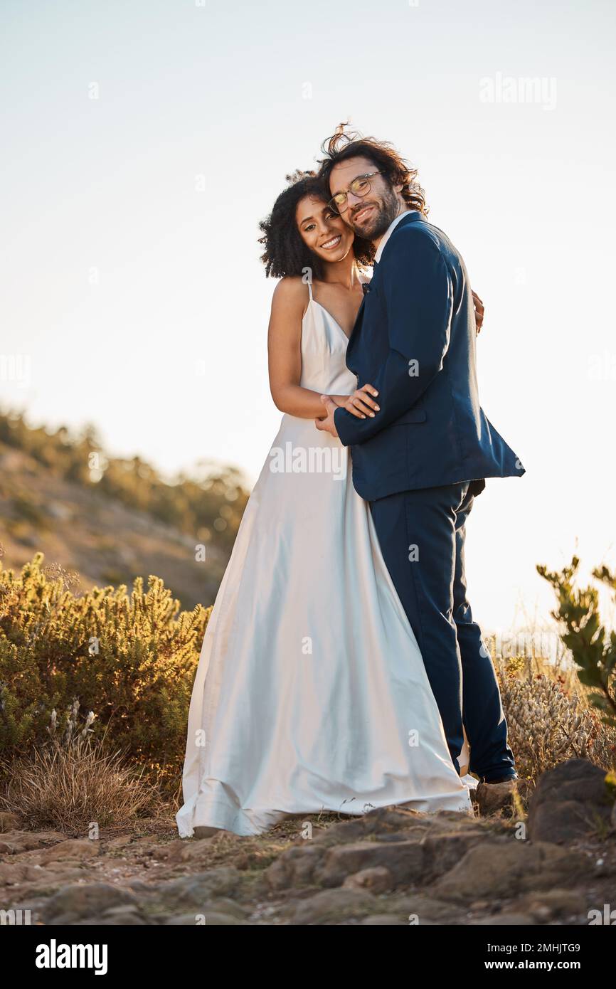 Wedding bride and groom portrait at sunset with embrace together for ...