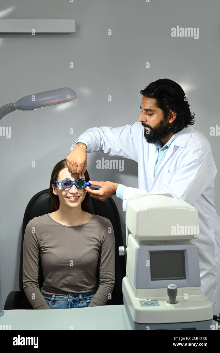 Ophthalmologist checking patient eyesight with ophthalmology ...
