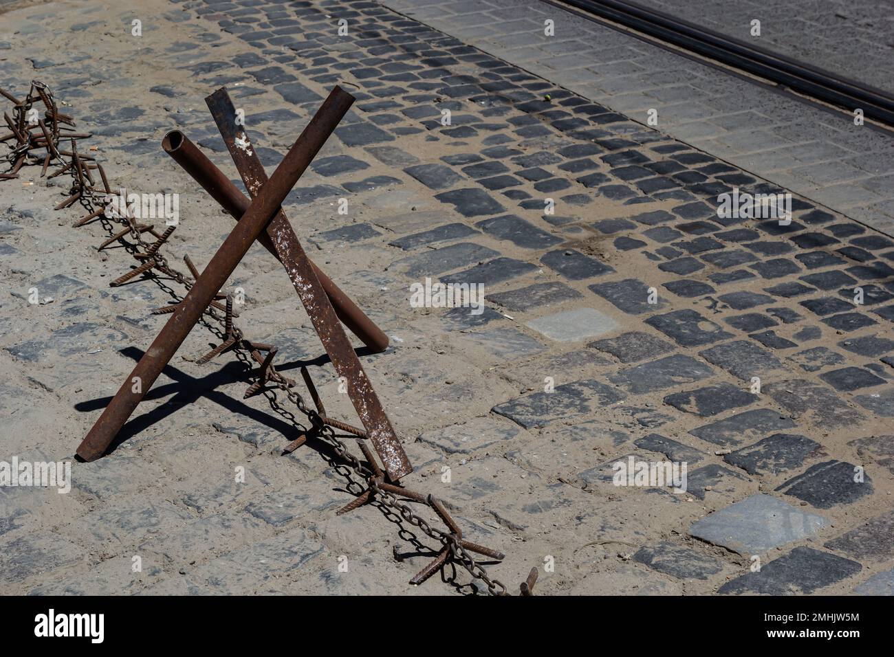 Iron hedgehog. Anti-tank barrier. Military industry. Block on the road ...