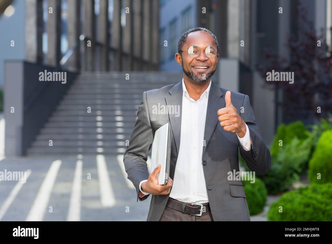 Portrait of successful african american man outside office building ...