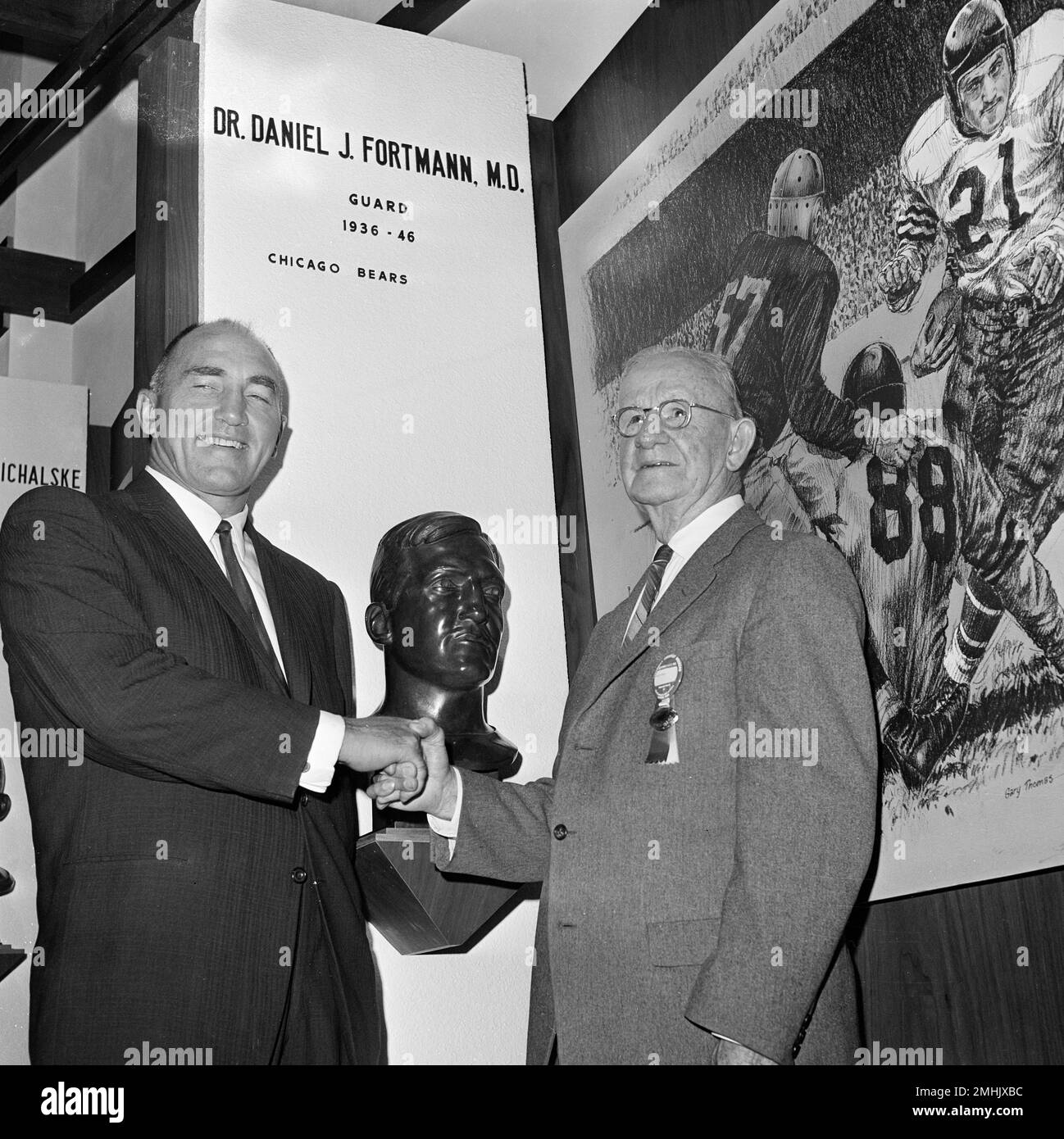 Dr. Daniel Fortmann, left, is inducted into the Pro Football Hall of ...