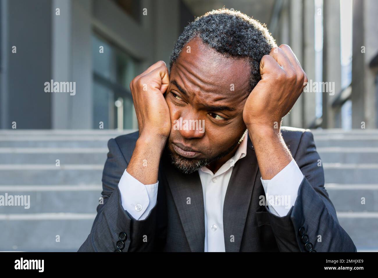 Man sitting on stairs hi-res stock photography and images - Alamy