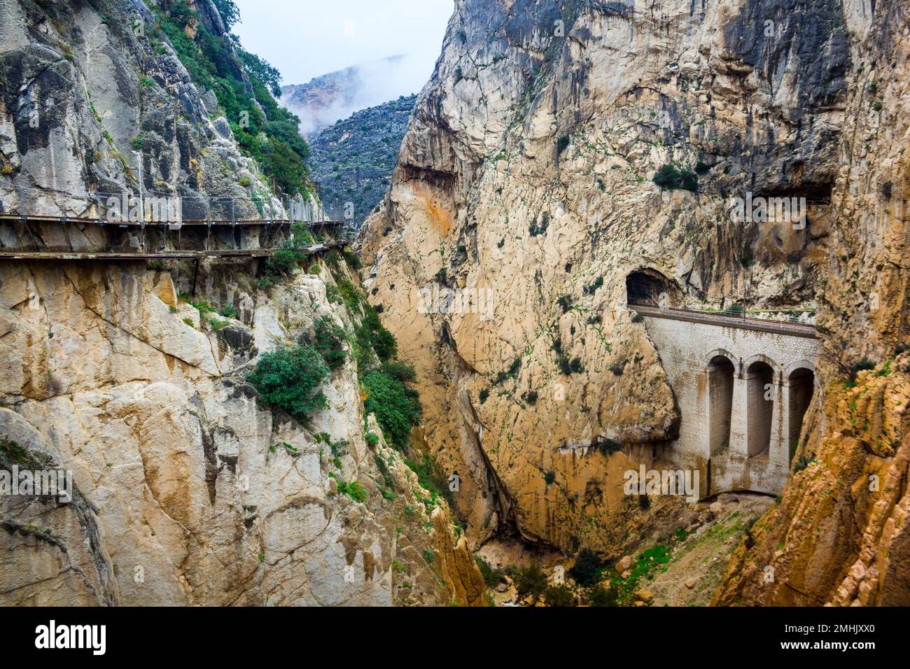 Deep canyon next to mountain path El Caminito del Rey in El Chorro ...