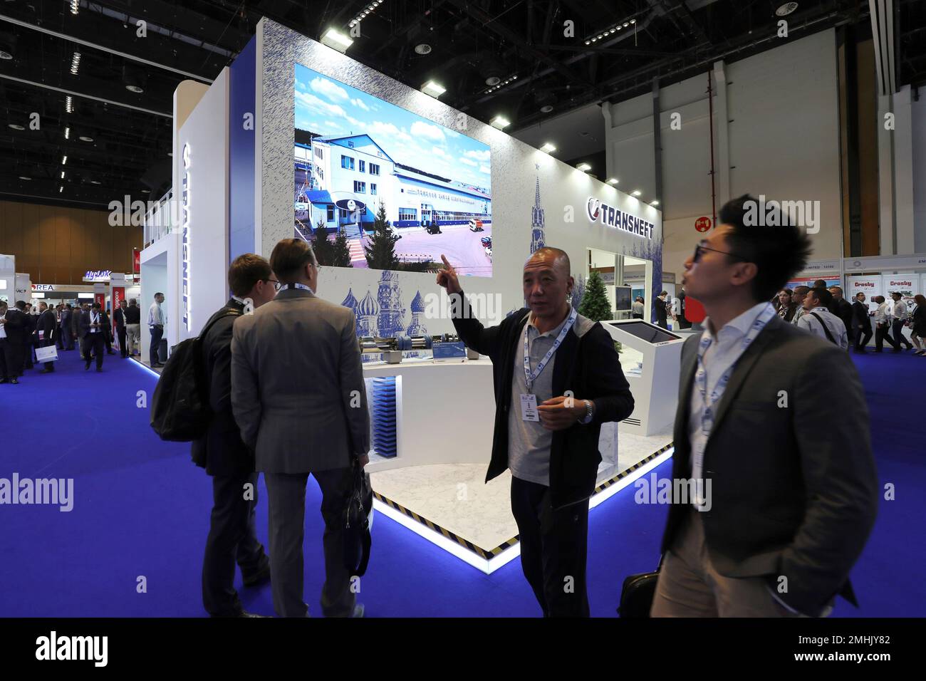 Visitors gather at the Transneft stand at the Abu Dhabi International ...