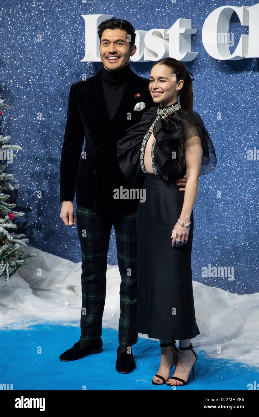 Henry Golding and Emilia Clarke pose for photographers upon arrival at ...