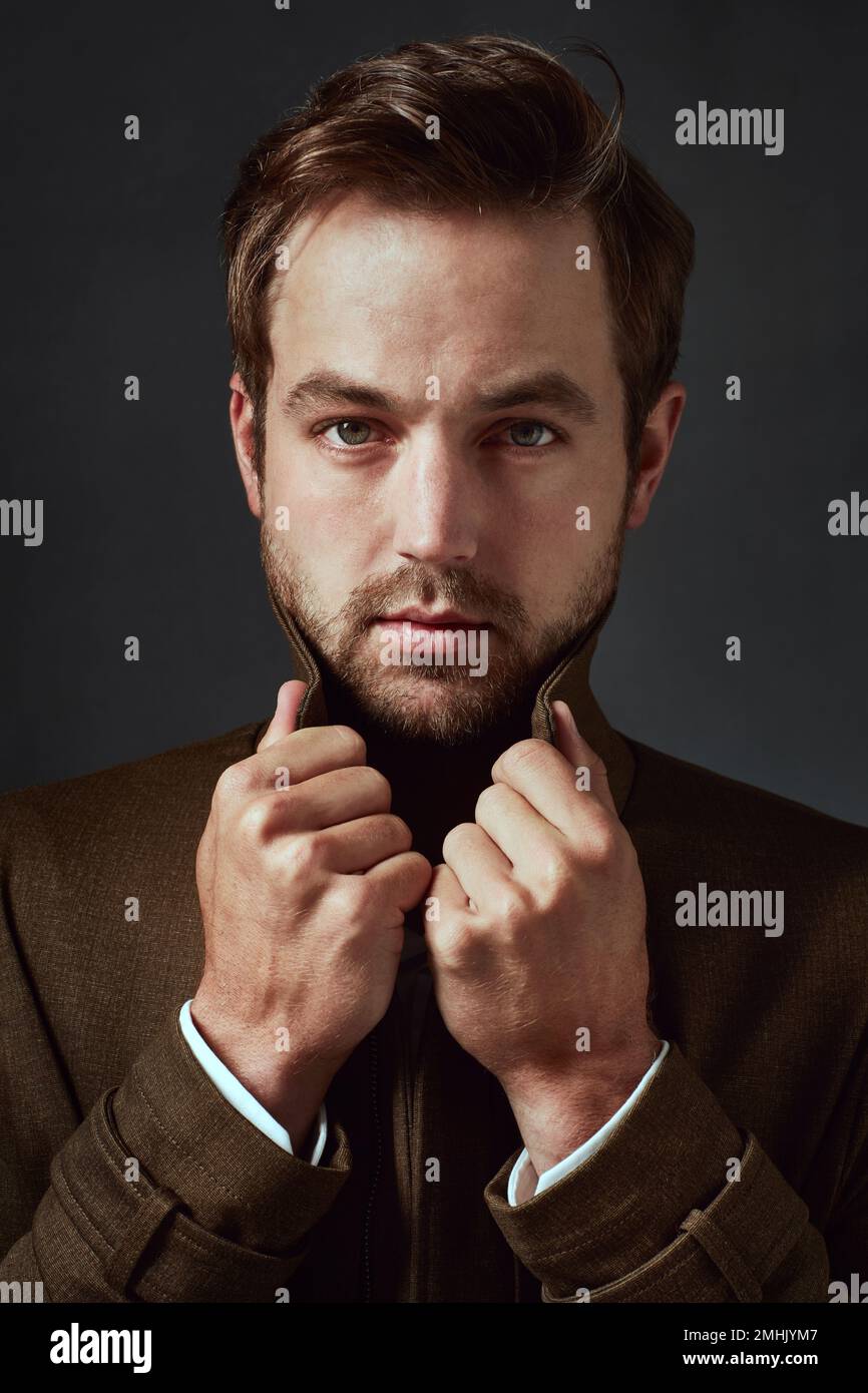 Time to turn up. Studio portrait of a handsome young man posing against ...