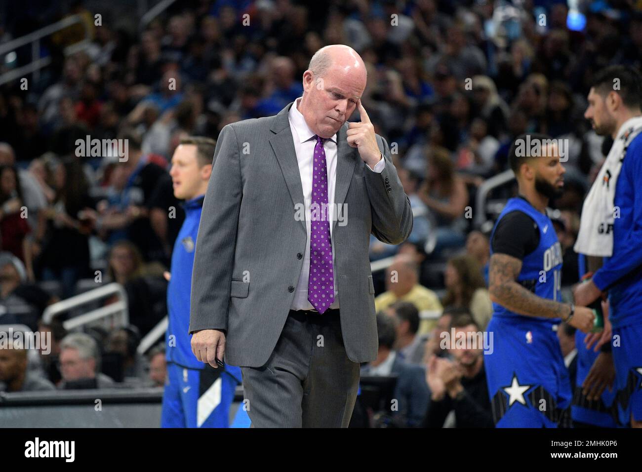 Orlando Magic head coach Steve Clifford, center, walks onto the court ...