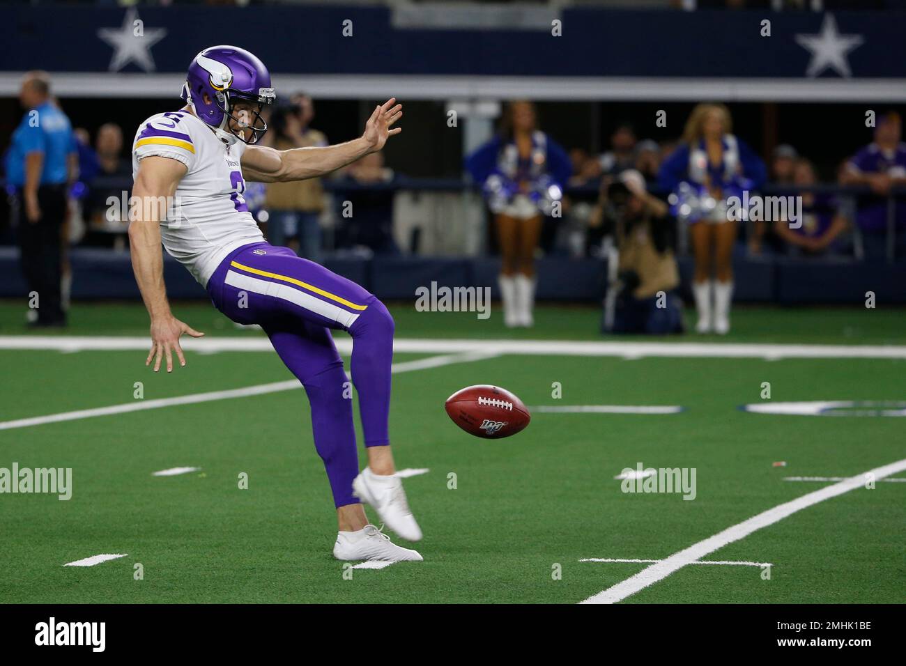 Minnesota Vikings punter Britton Colquitt (2) punts during a game ...