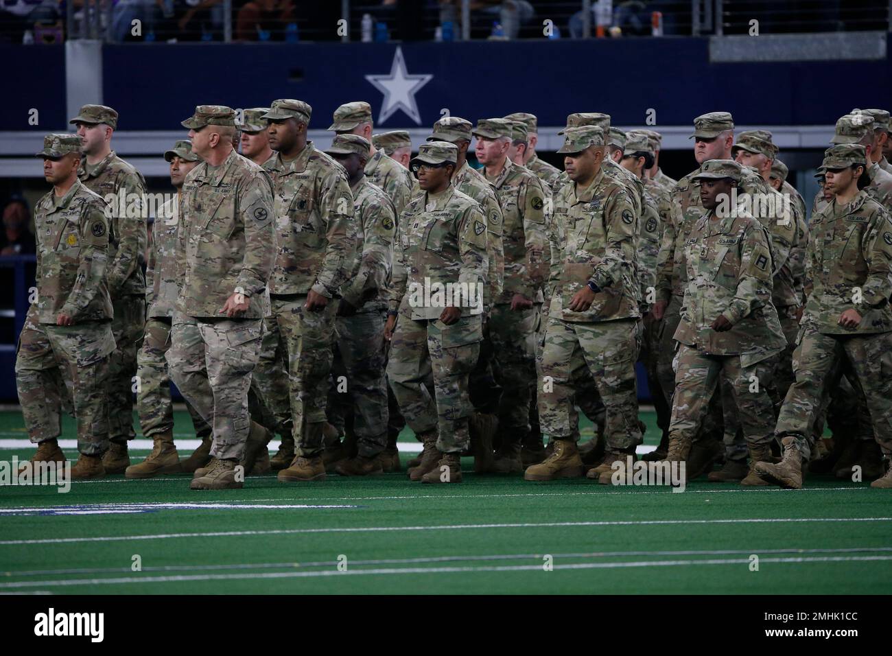 United States Army soldiers march on the field at half time during a ...