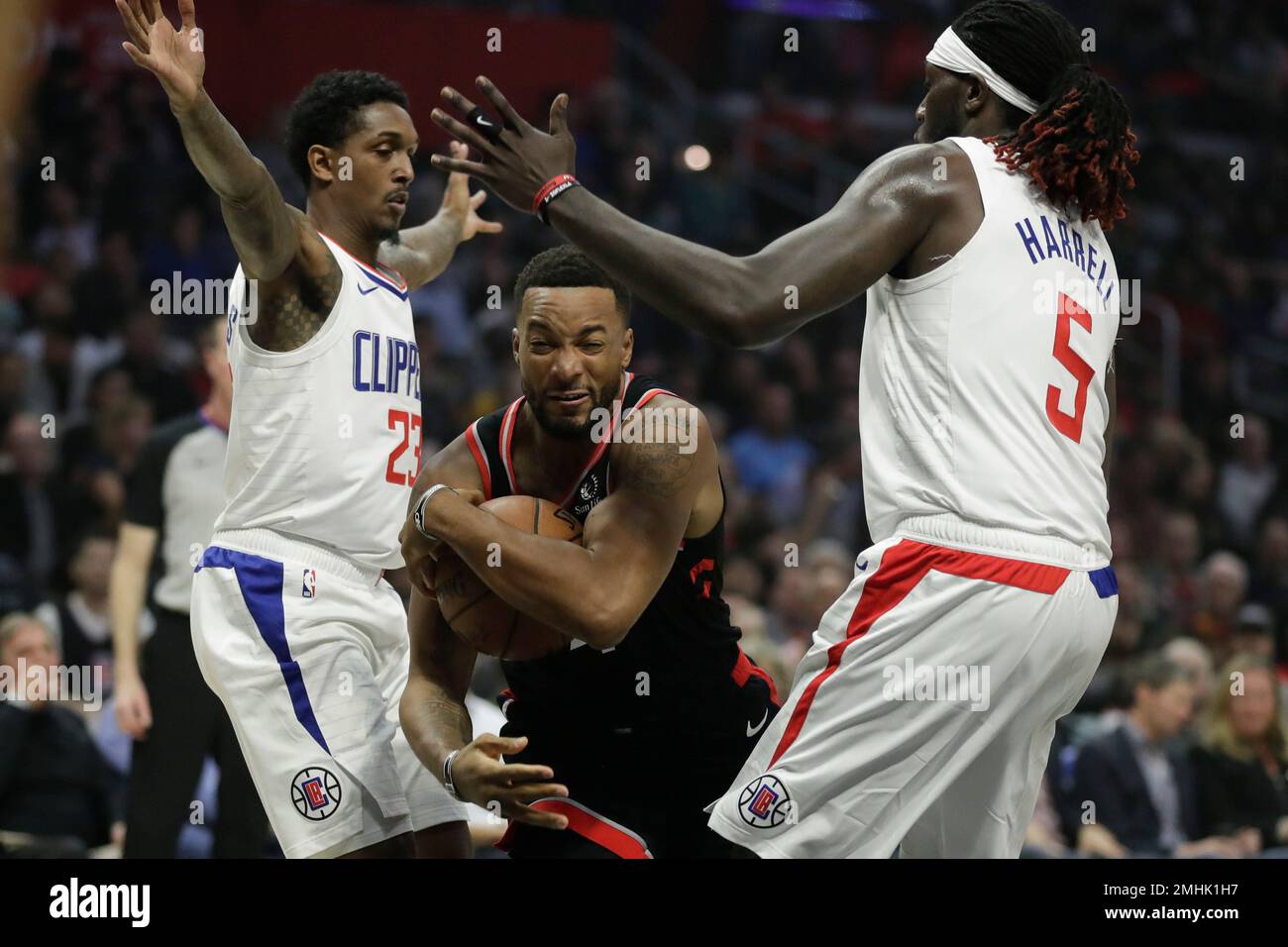 Toronto Raptors guard Norman Powell drives between Los Angeles Clippers ...