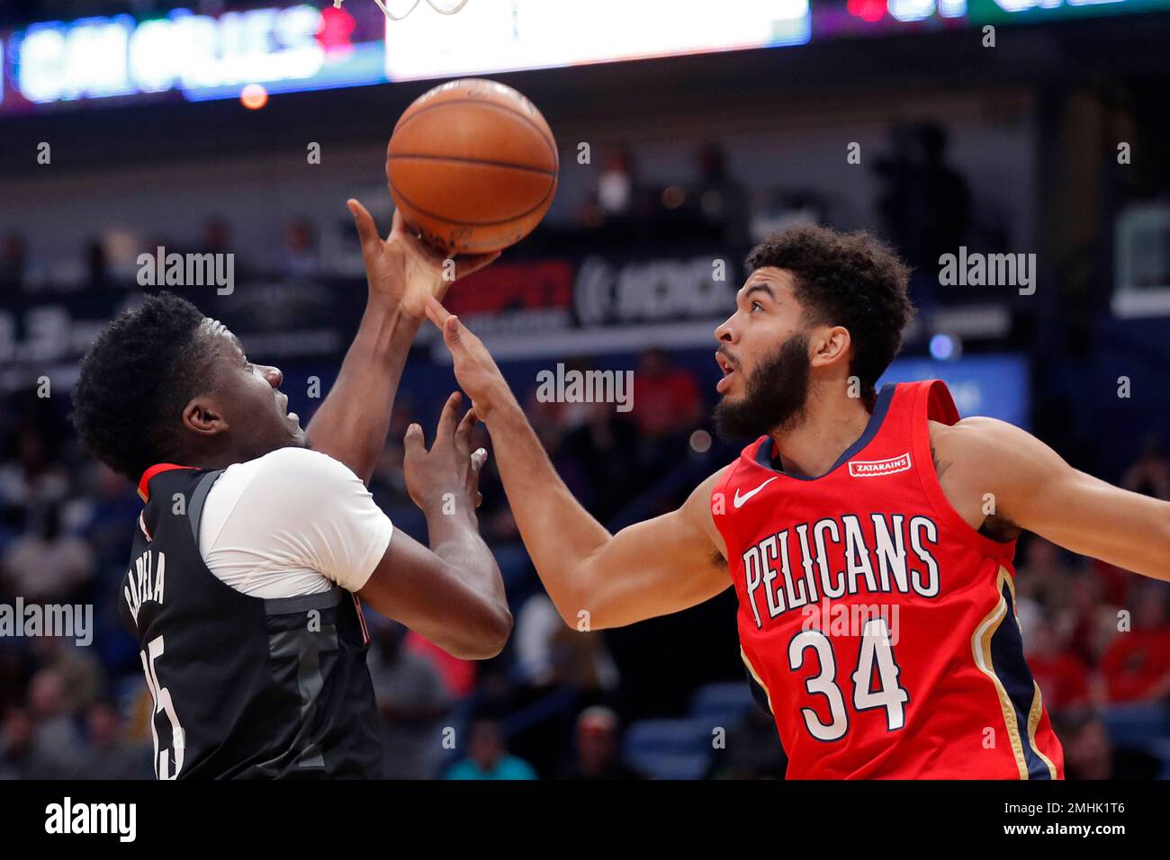 Houston Rockets center Clint Capela (15) and New Orleans Pelicans guard Kenrich Williams (34 ...
