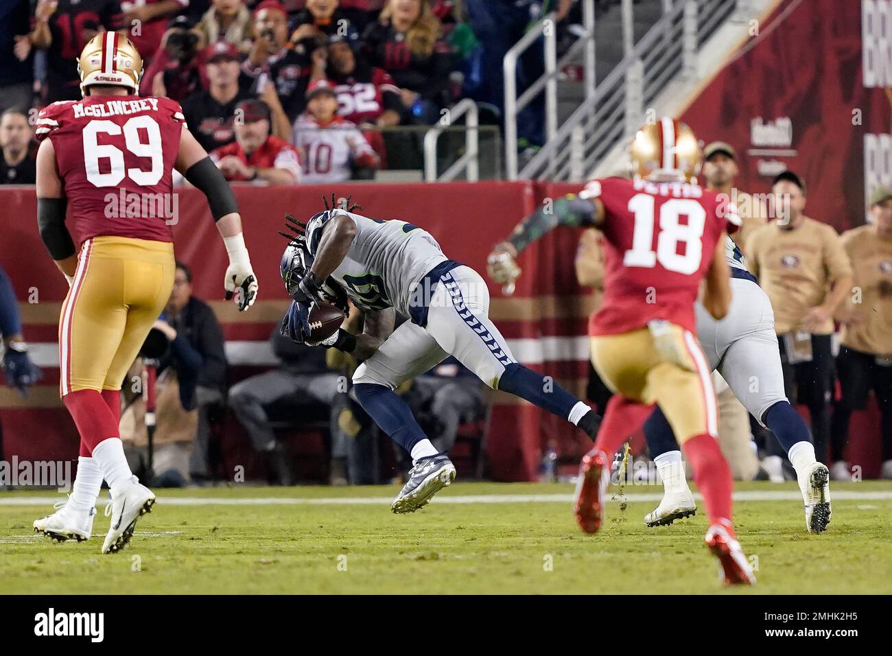 Seattle Seahawks defensive end Jadeveon Clowney, center, returns a ...