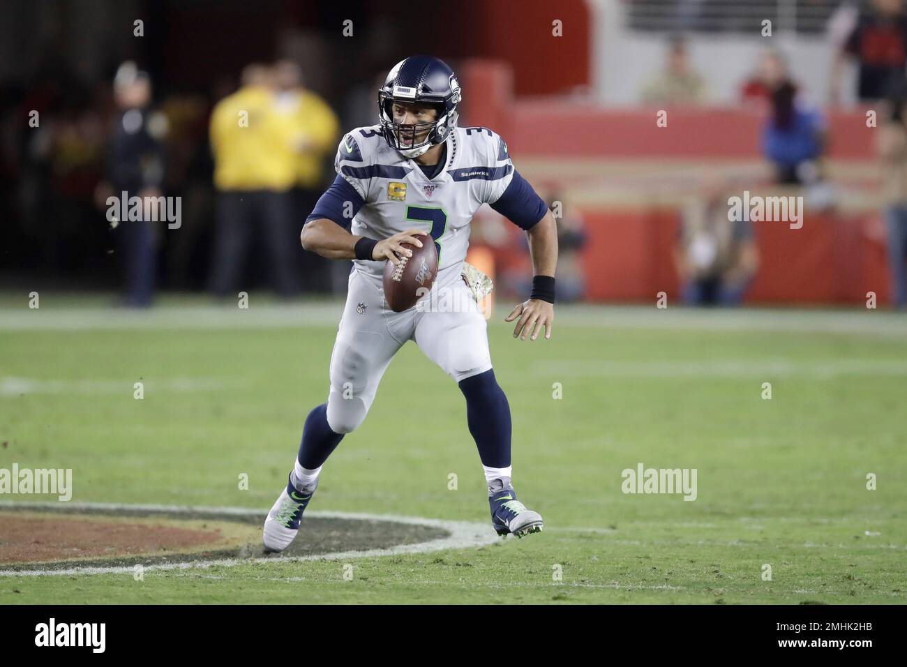 Seattle Seahawks quarterback Russell Wilson (3) rolls out against the ...